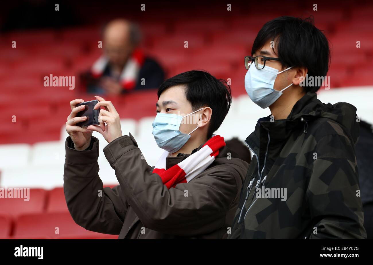 Fans in masks during the Premier League match at the Emirates Stadium ...