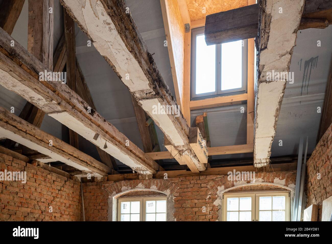 in an old building that is being restored, old wooden beams are ...