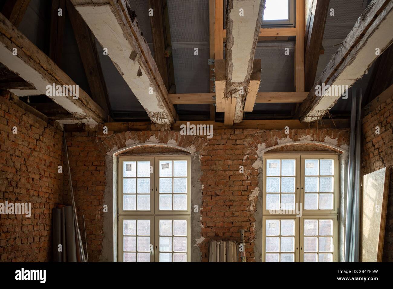in an old building that is being restored, old wooden beams are ...