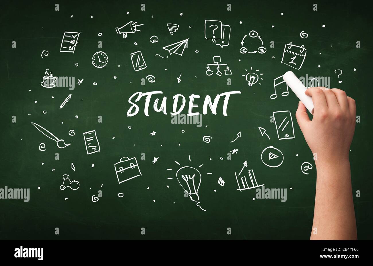 Hand drawing STUDENT inscription with white chalk on blackboard ...