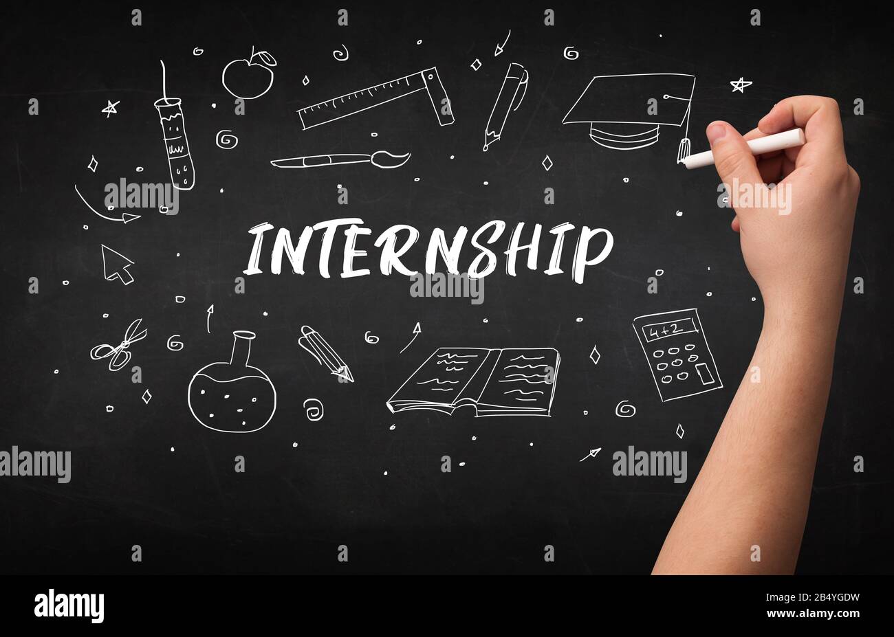 Hand drawing INTERNSHIP inscription with white chalk on blackboard ...