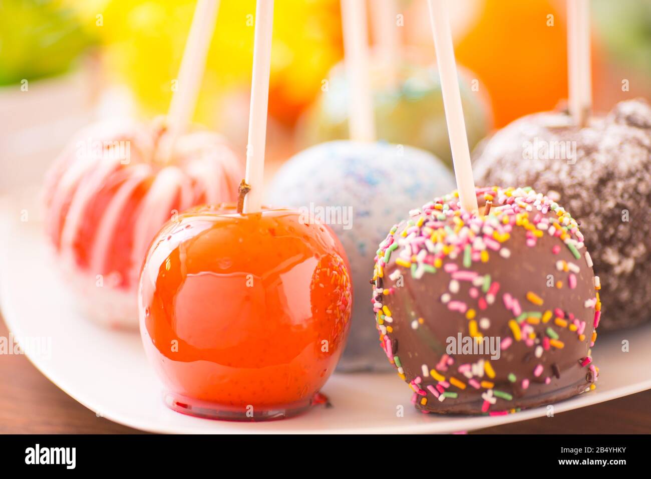 Apple coated dessert with candy Stock Photo - Alamy