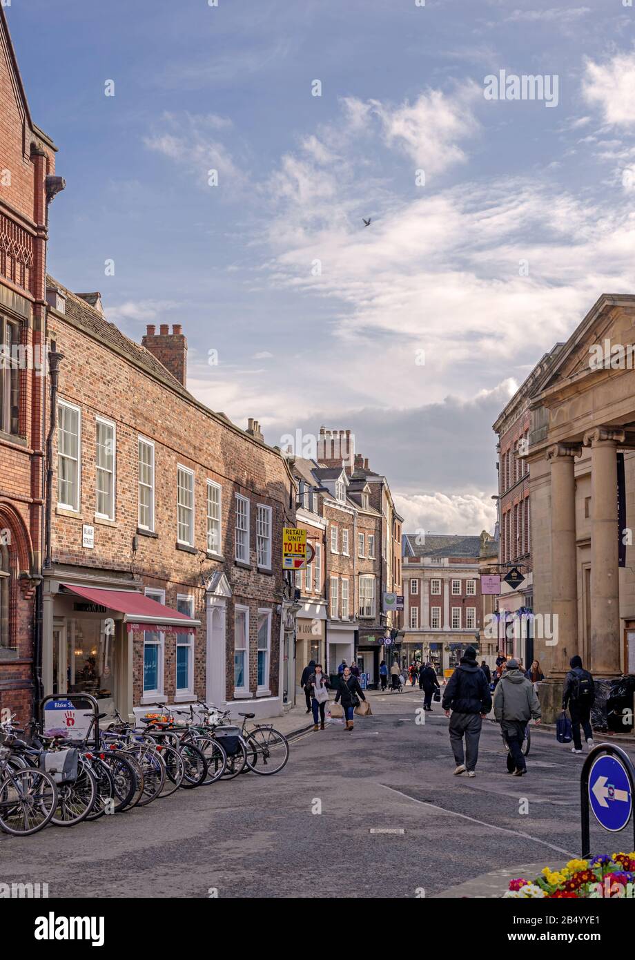 Blake Street in York. There is a flower bed in the foreground and a row ...