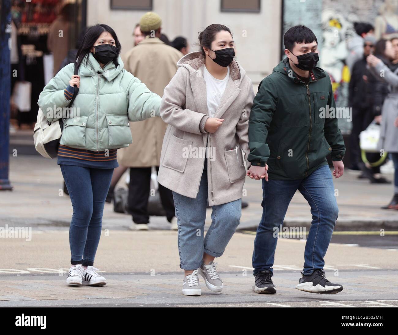 People wearing face masks in central London Stock Photo - Alamy