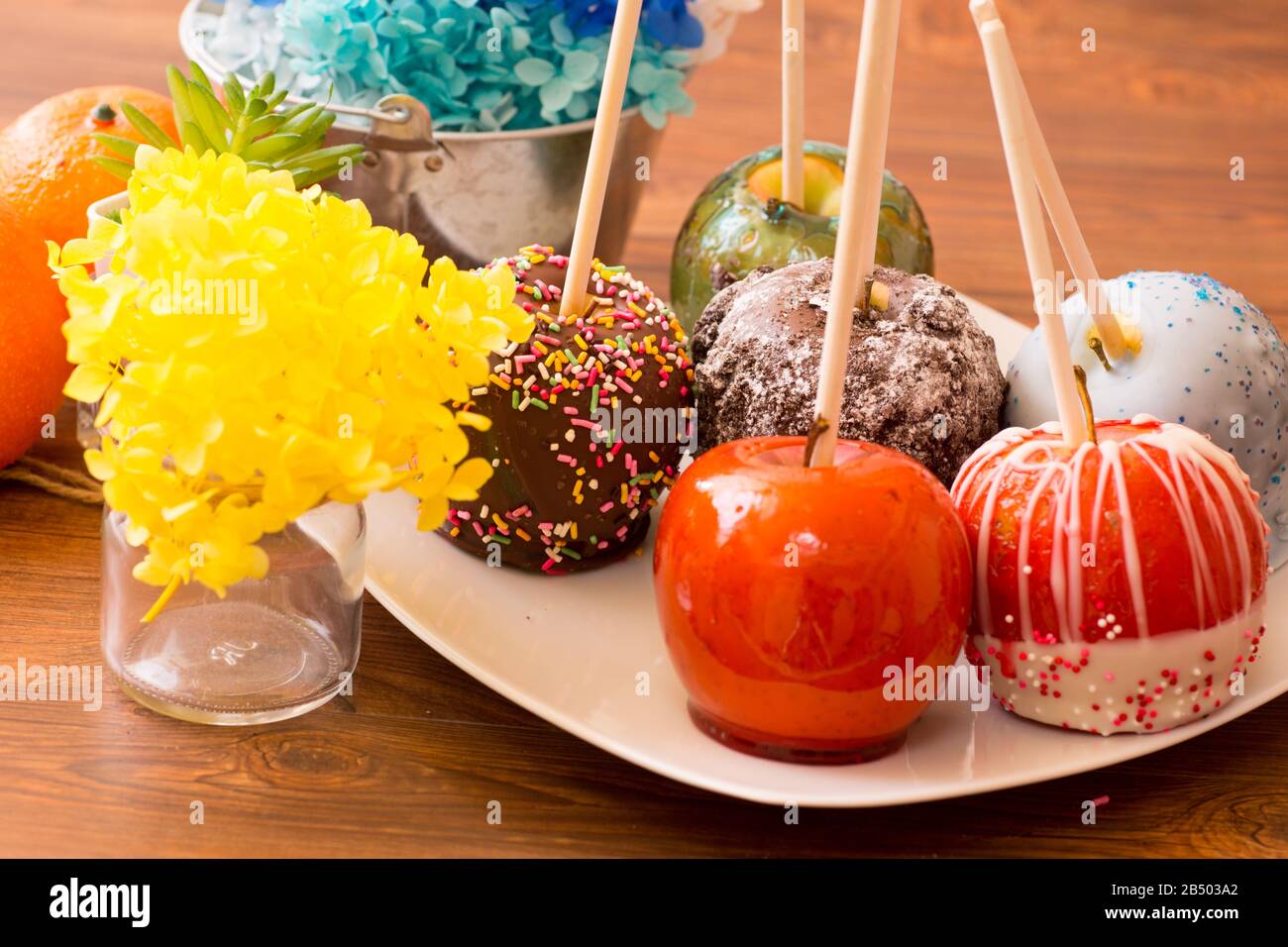 Apple coated dessert with candy Stock Photo - Alamy