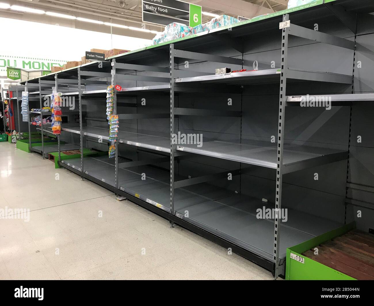 Empty shelves where toilet roll is usually stocked in an Asda store in ...
