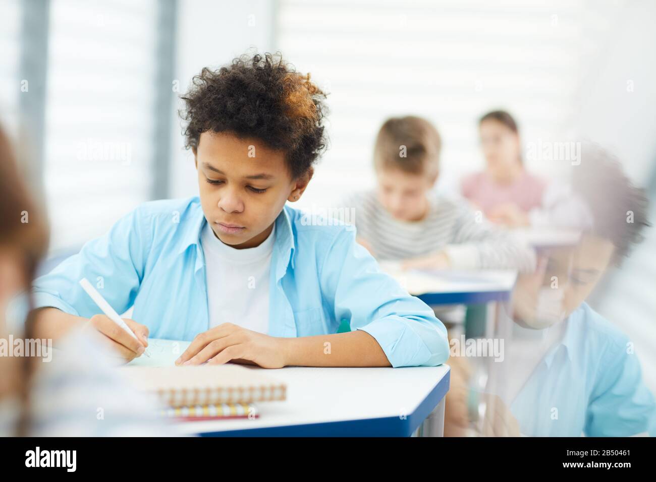 Horizontal medium portrait of pensive African American sitting in ...