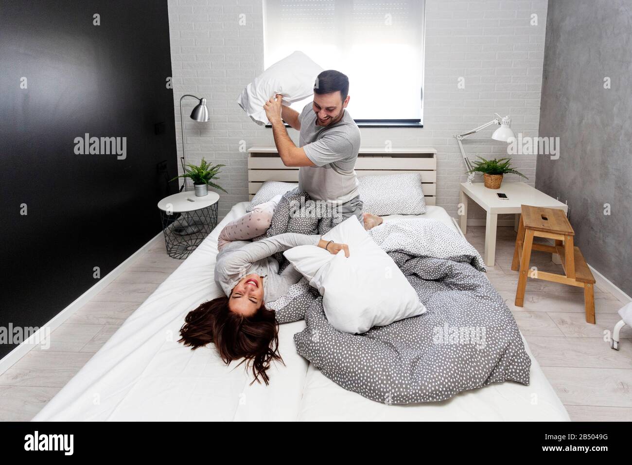 Couple in bed early in the morning Stock Photo - Alamy