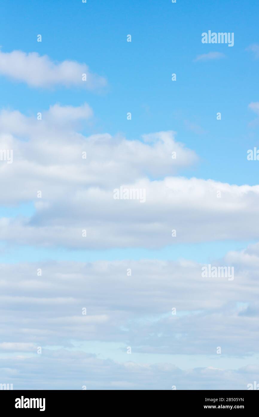 blue sky with flying white light clouds Stock Photo - Alamy