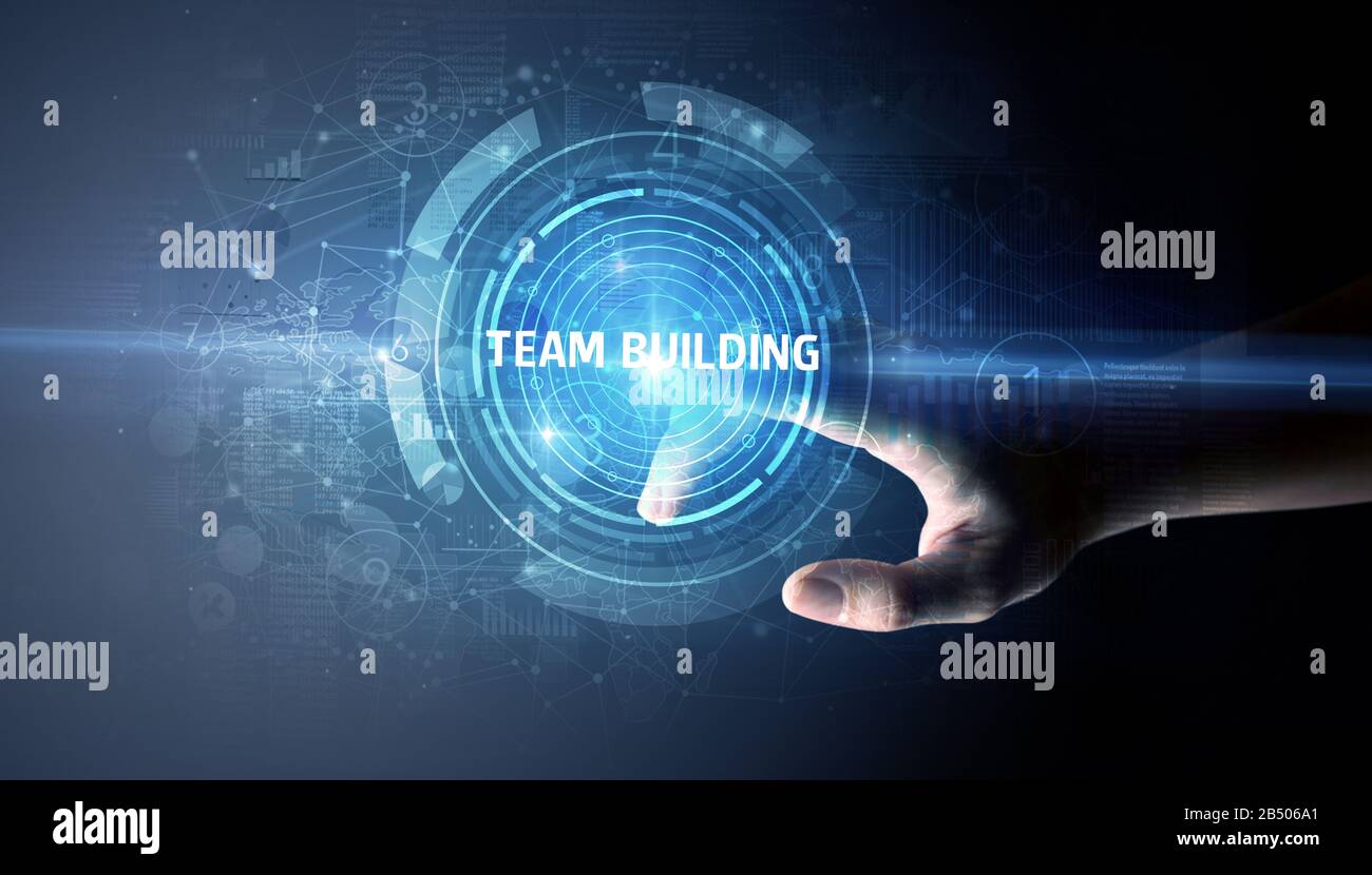 Hand touching TEAM BUILDING button, modern business technology concept ...