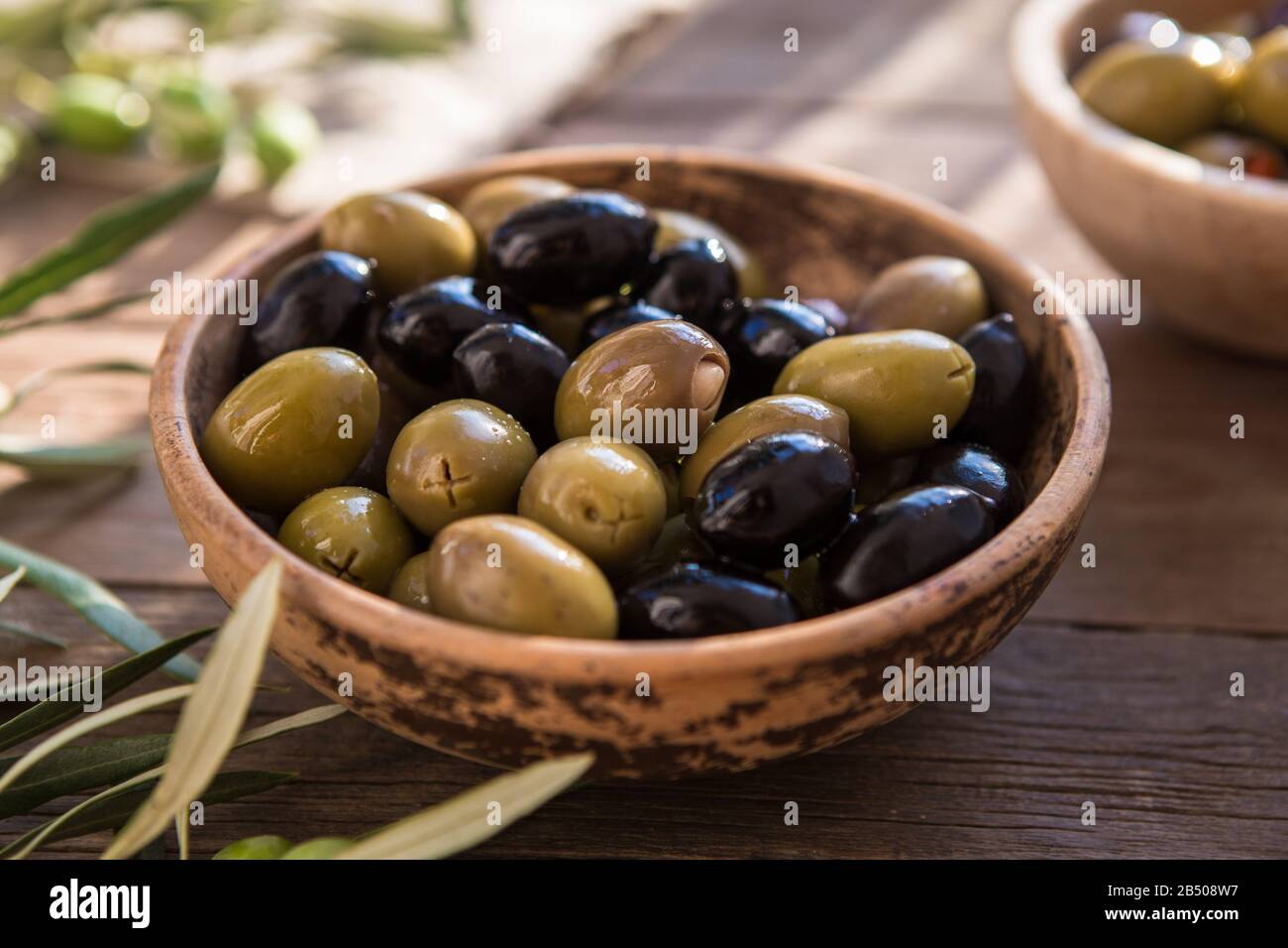 bowls with different kind of olives green olives, black olives, olives ...