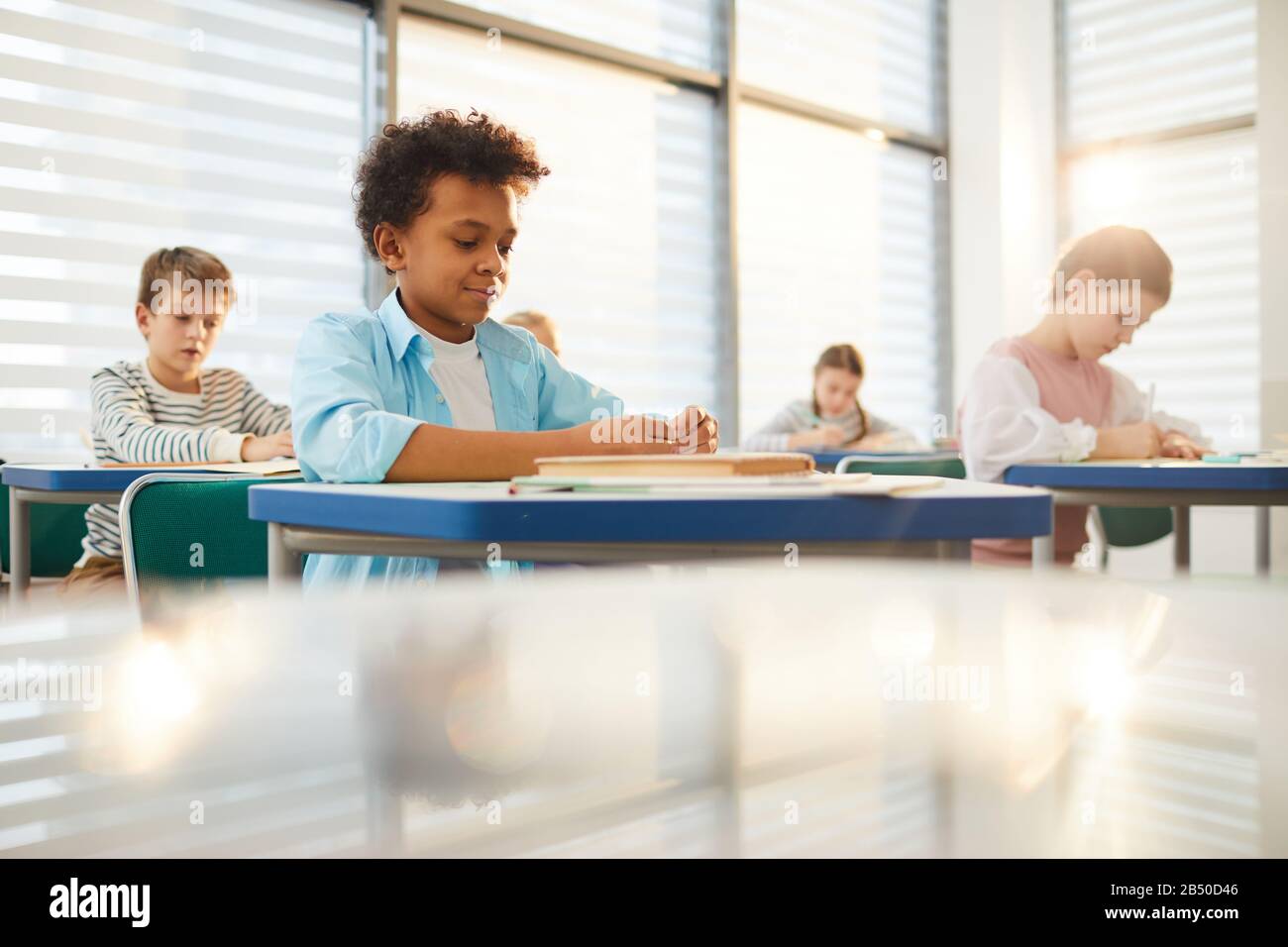 Middle School Students Studying In Class