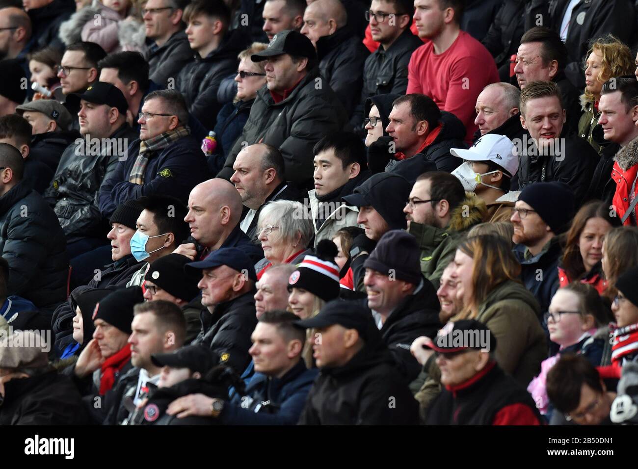 Fans in the stands, some wearing face masks during the Premier League ...