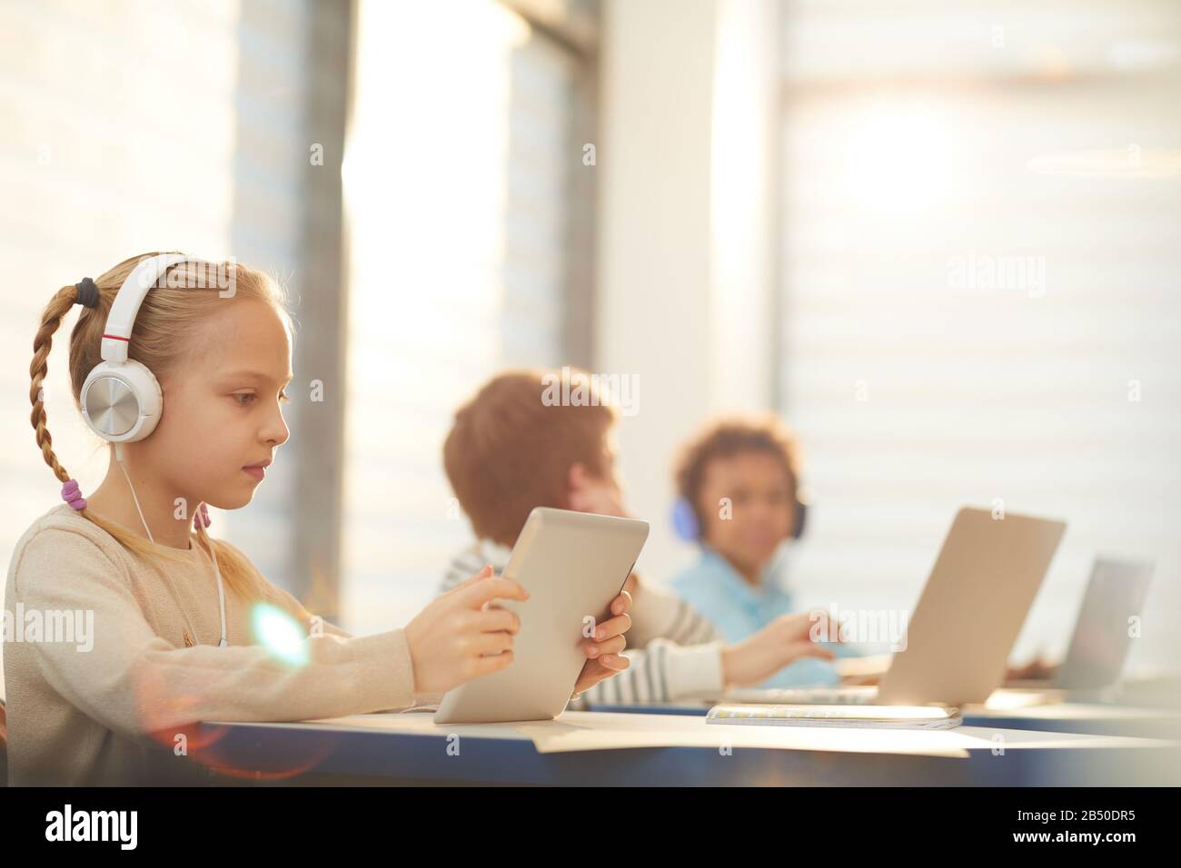 Students working computers during lesson hi-res stock photography and ...