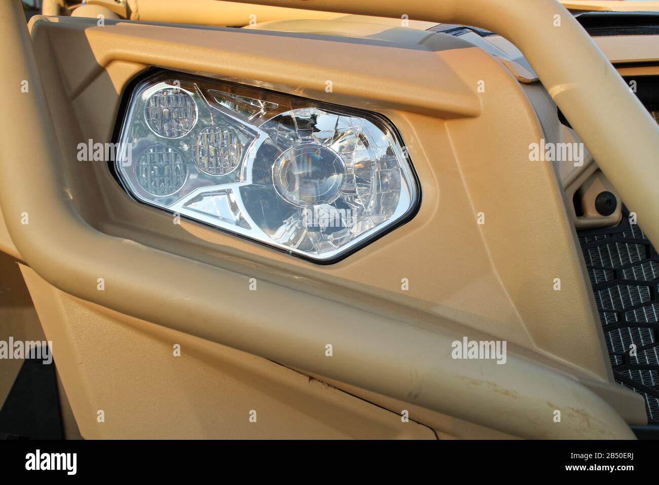 front view of the headlight of a modern armored military police car ...