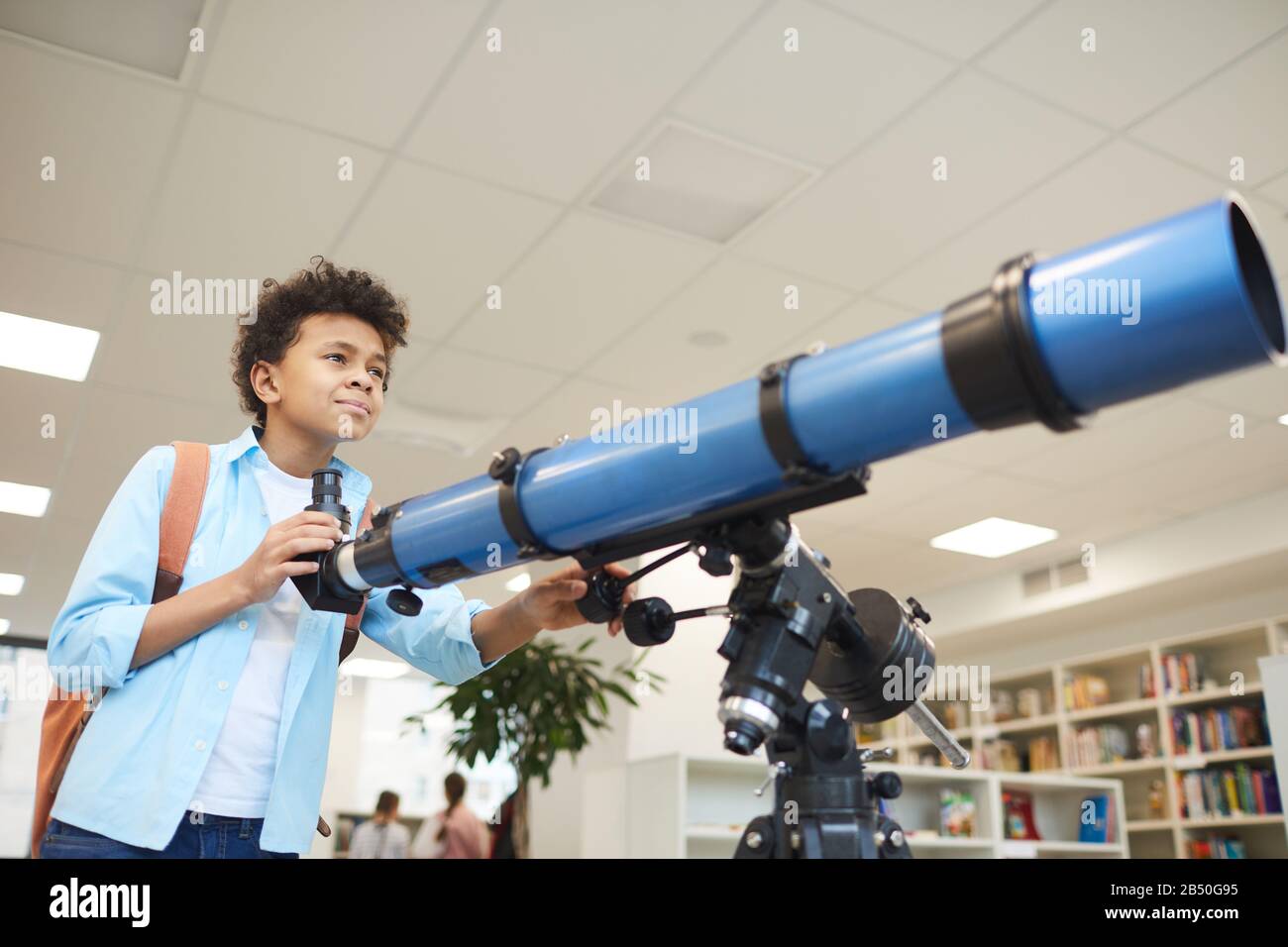 Horizontal medium low angle shot of African American middle schooler ...