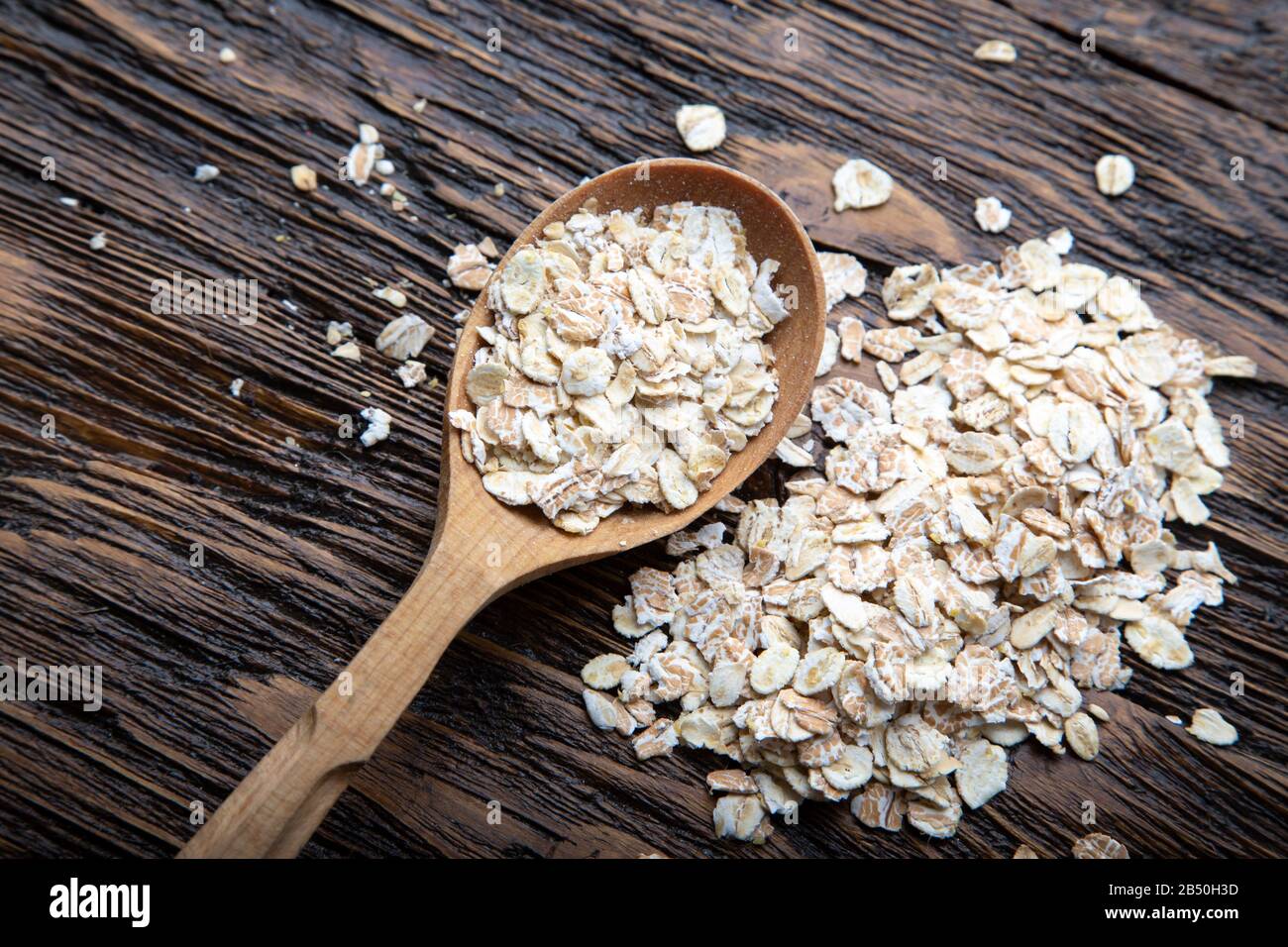 Raw oatmeal on the table. Useful food Stock Photo - Alamy