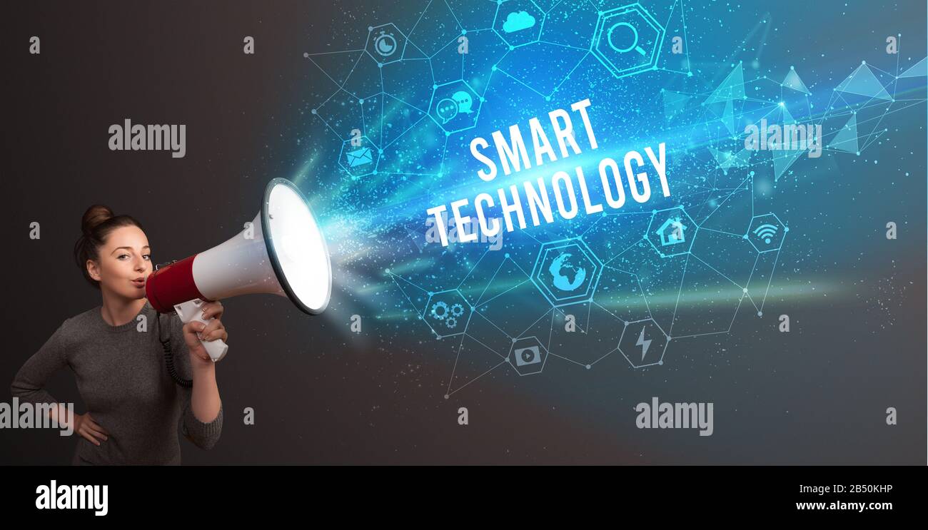 Young woman shouting in megaphone with SMART TECHNOLOGY inscription ...
