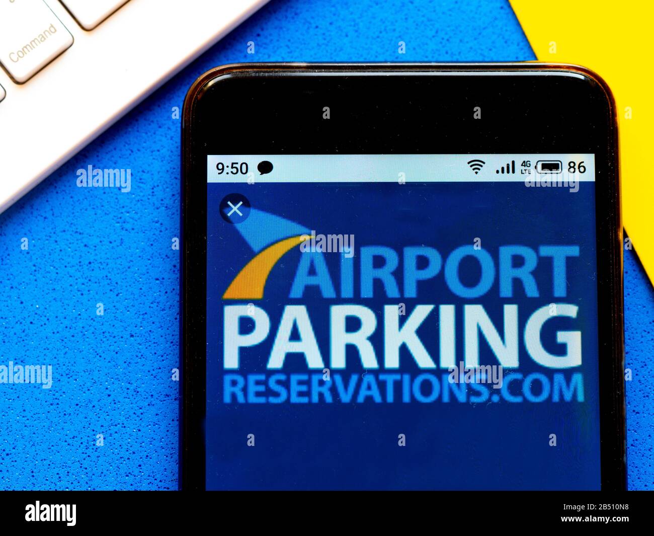 In this photo illustration the Airport Parking Reservation logo is seen ...