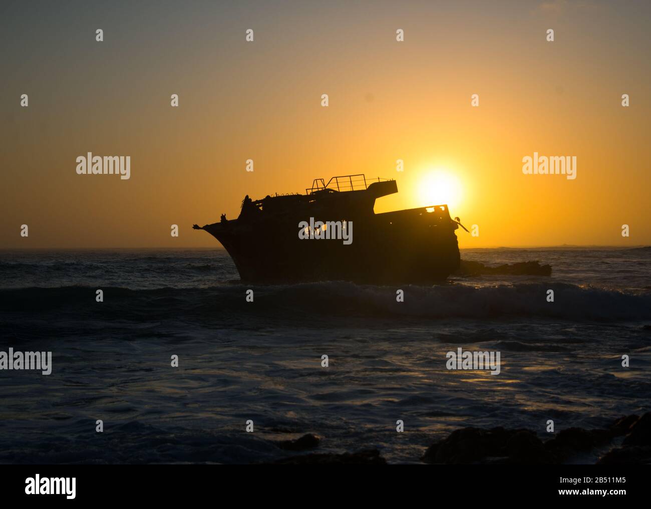 sunset behind shipwreck of japanese trawler meisho maru no 38 near cape ...