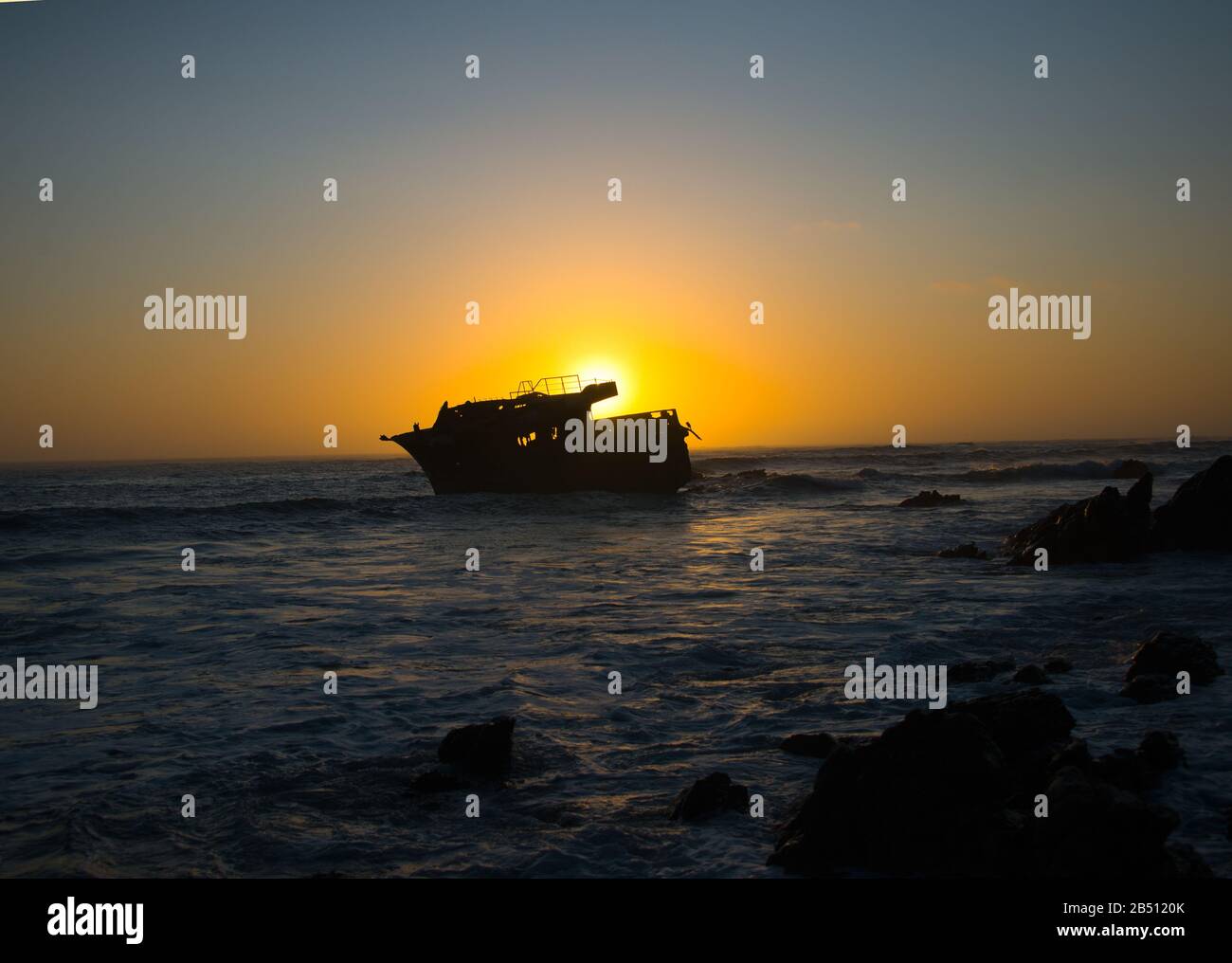 sunset behind shipwreck of japanese trawler meisho maru no 38 near cape ...