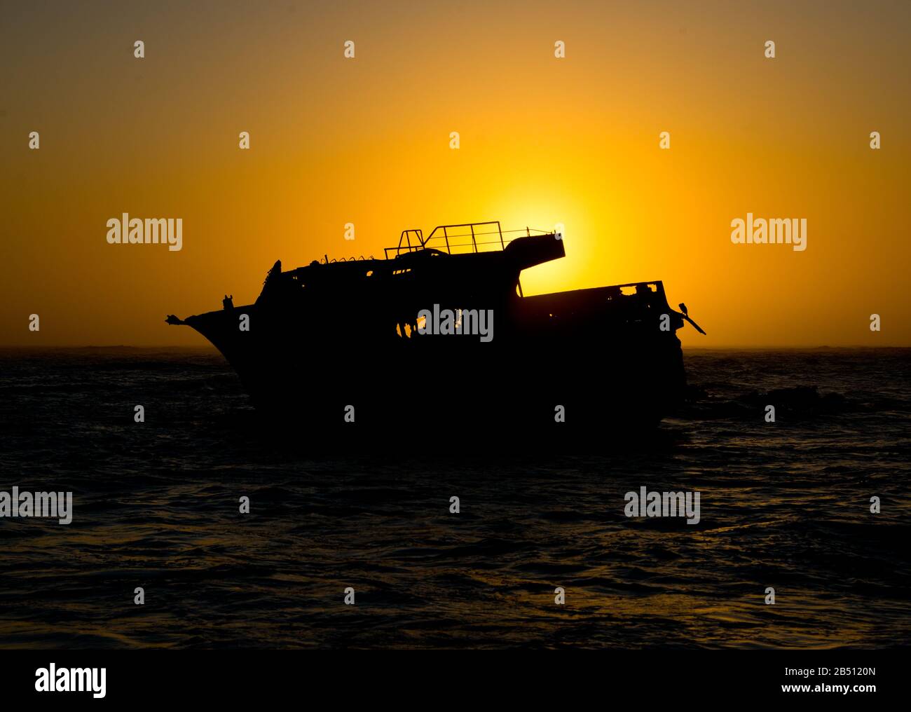 sunset behind shipwreck of japanese trawler meisho maru no 38 near cape ...