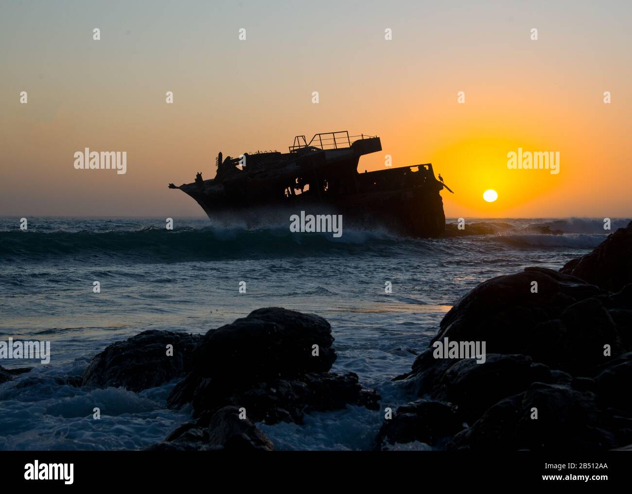 sunset behind shipwreck of japanese trawler meisho maru no 38 near cape ...