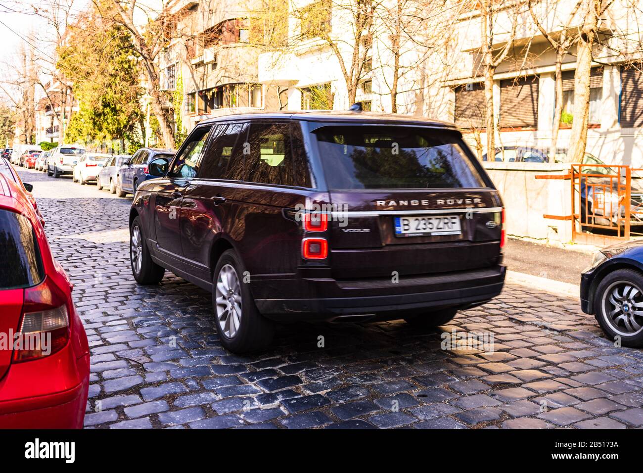 Car traffic in downtown area of Bucharest. Car pollution, traffic jam ...