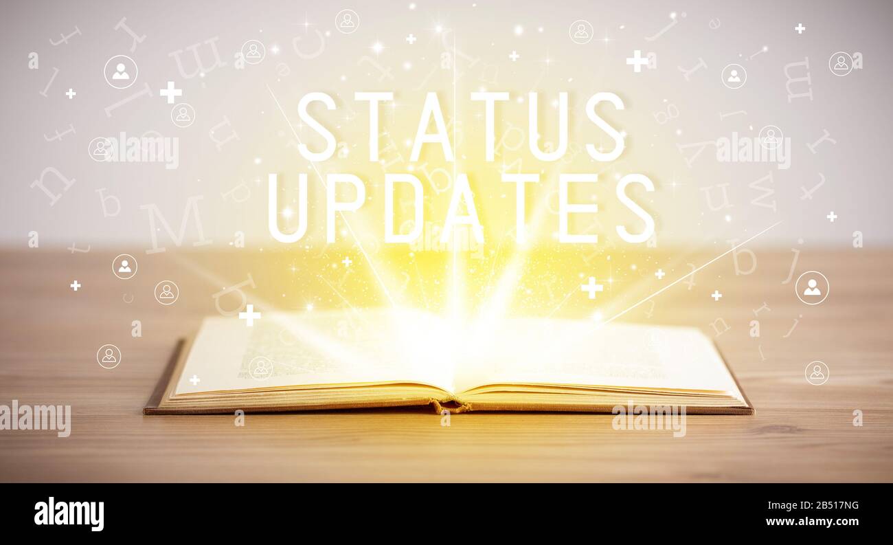Open book with STATUS UPDATES inscription, social media concept Stock ...