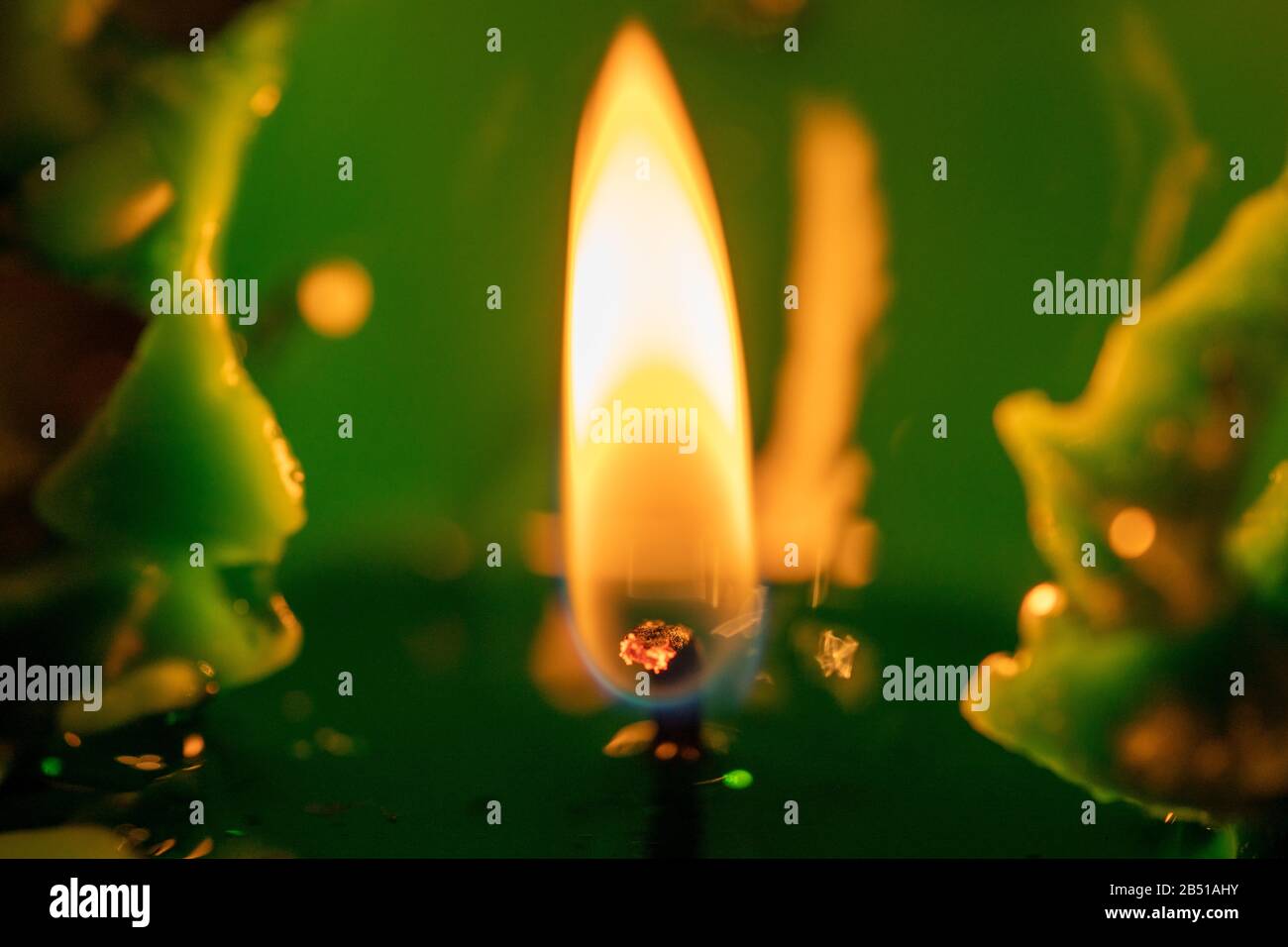 Single candle burning green hi-res stock photography and images - Alamy