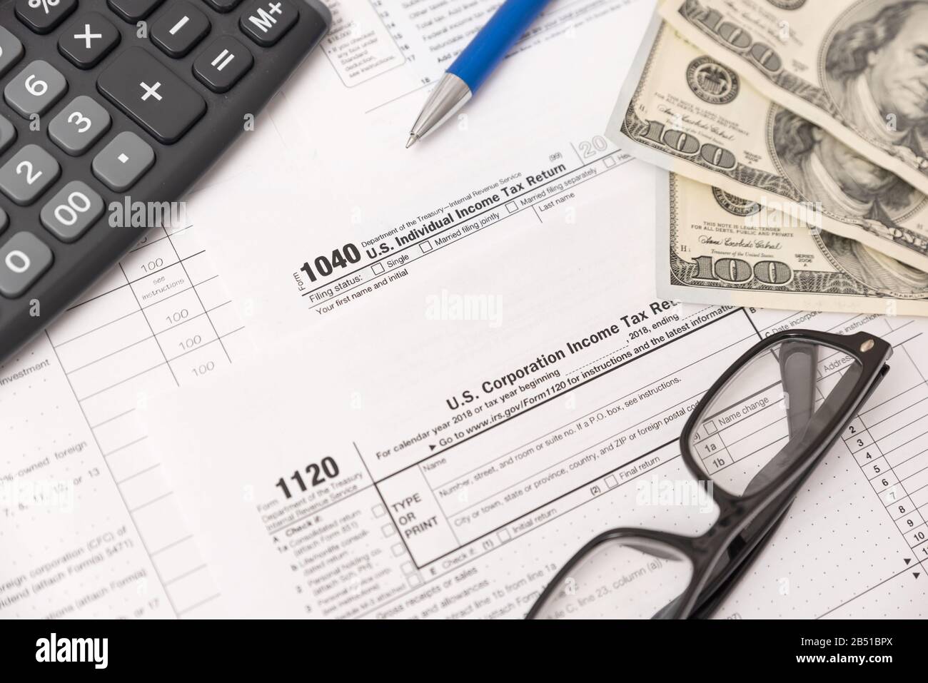 US tax form on desk composition. Tax income concept Stock Photo - Alamy