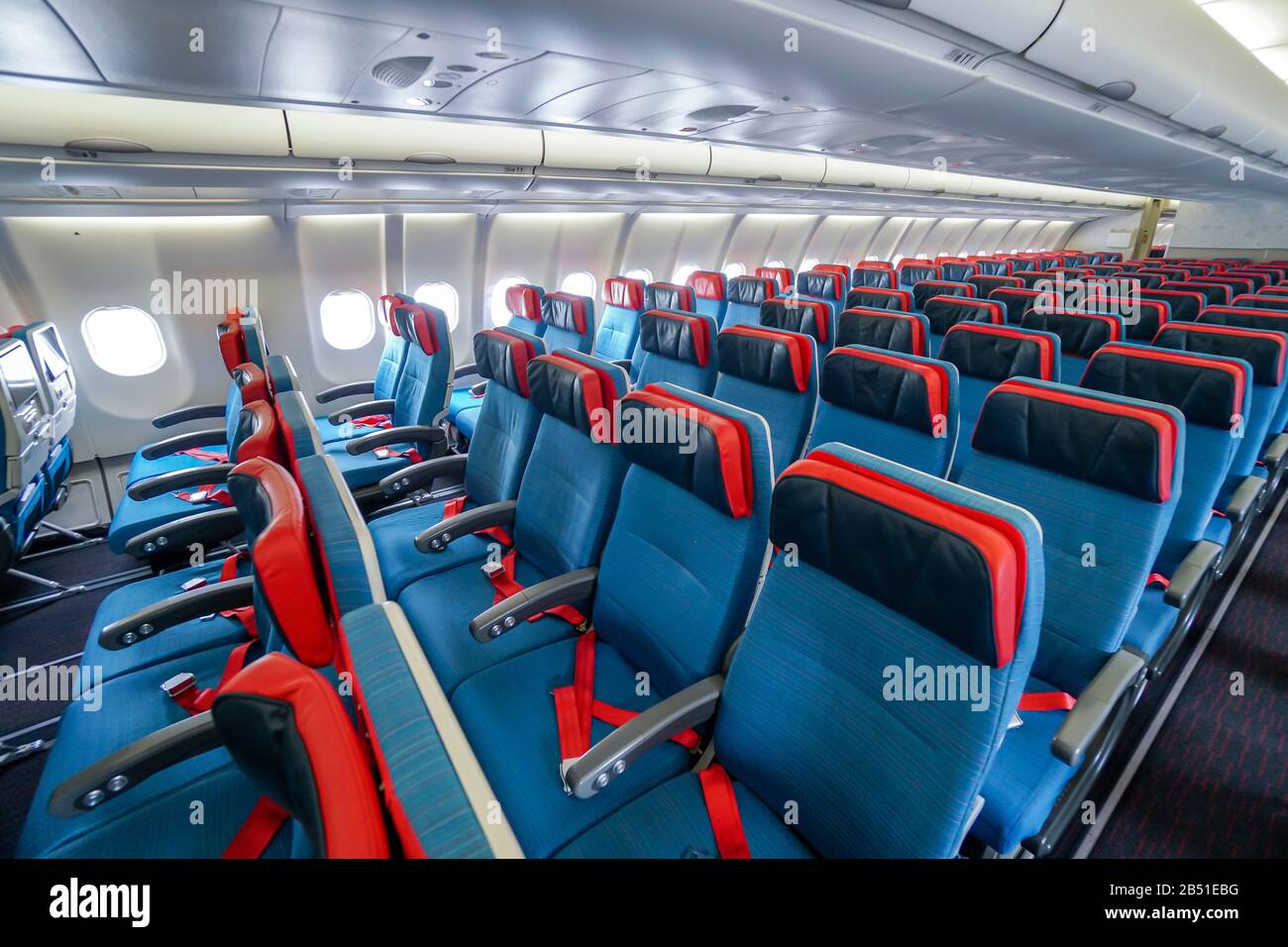 Aircraft interior. The passenger cabin of modern passenger airplane ...