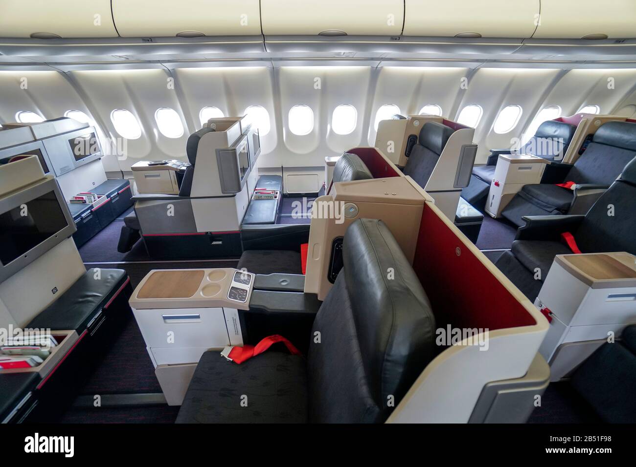 Seats of business class inside airplane Stock Photo - Alamy