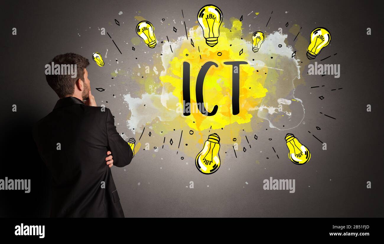 businessman drawing colorful light bulb with ICT abbreviation, new ...