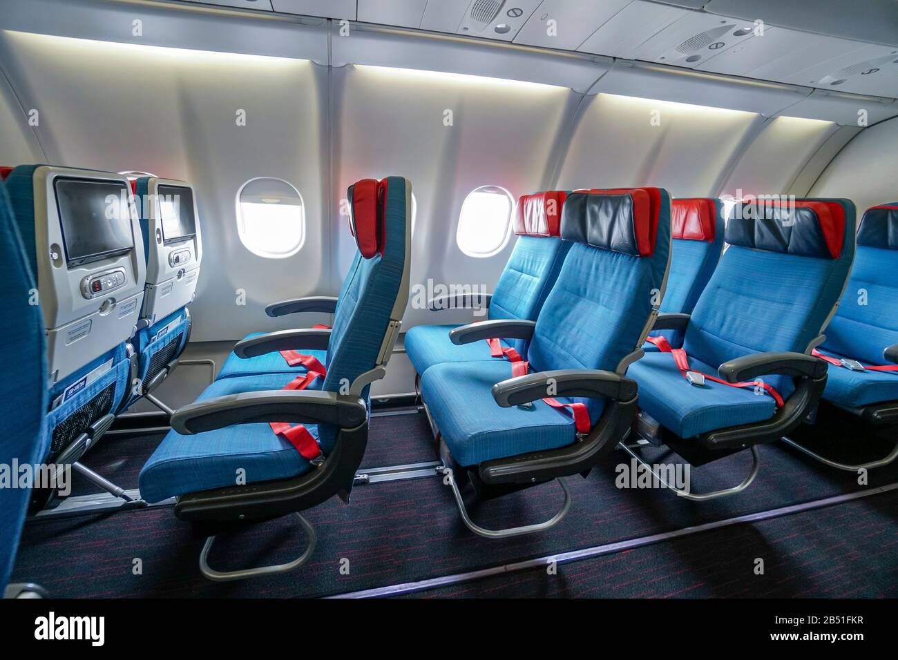 Aircraft interior. The passenger cabin of modern passenger airplane ...