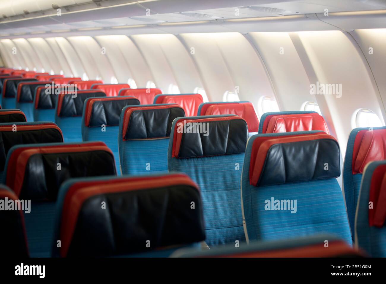 Aircraft interior. The passenger cabin of modern passenger airplane ...