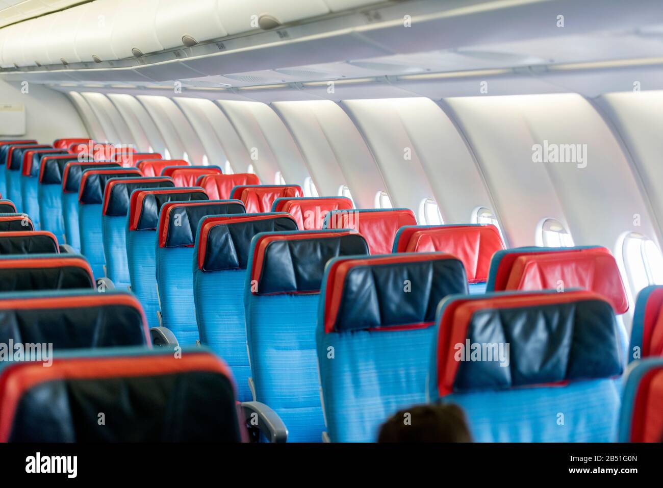 Aircraft interior. The passenger cabin of modern passenger airplane ...