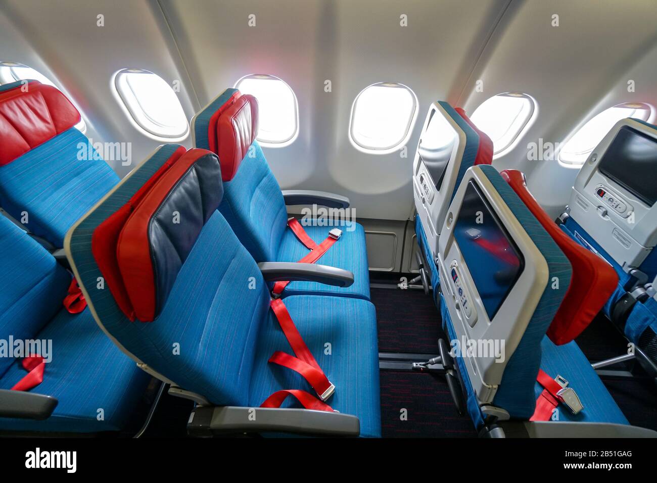 Aircraft interior. The passenger cabin of modern passenger airplane ...