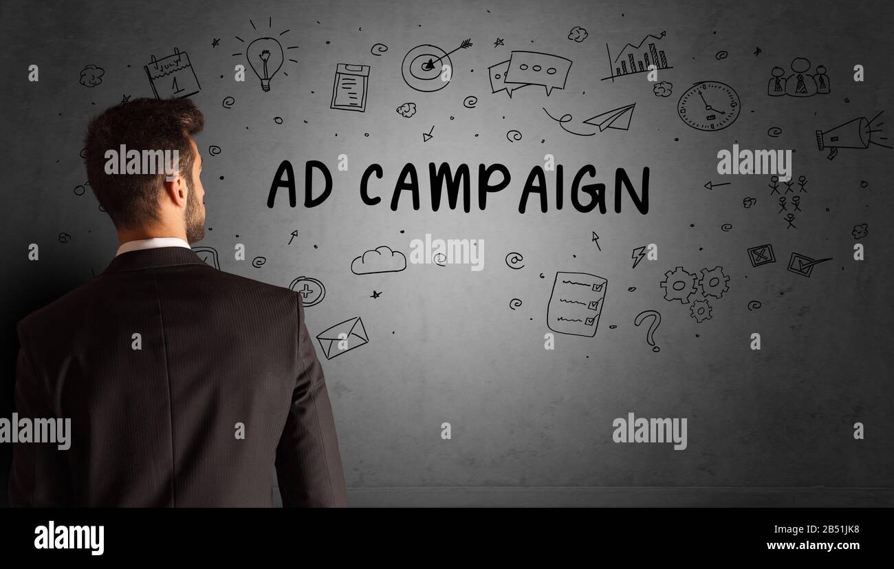 businessman drawing a creative idea sketch with AD CAMPAIGN inscription ...