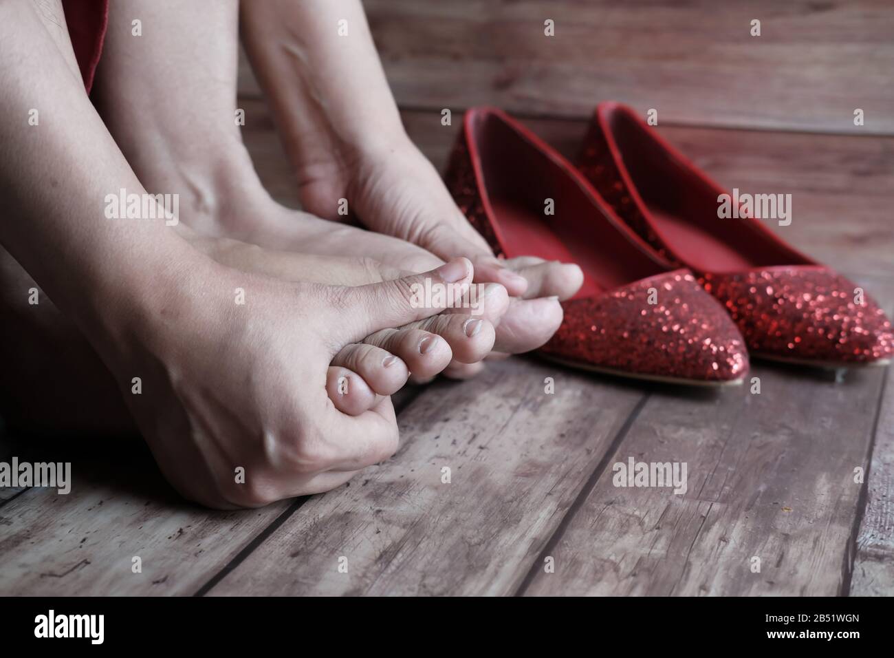 young women suffering feet pain, close up Stock Photo - Alamy