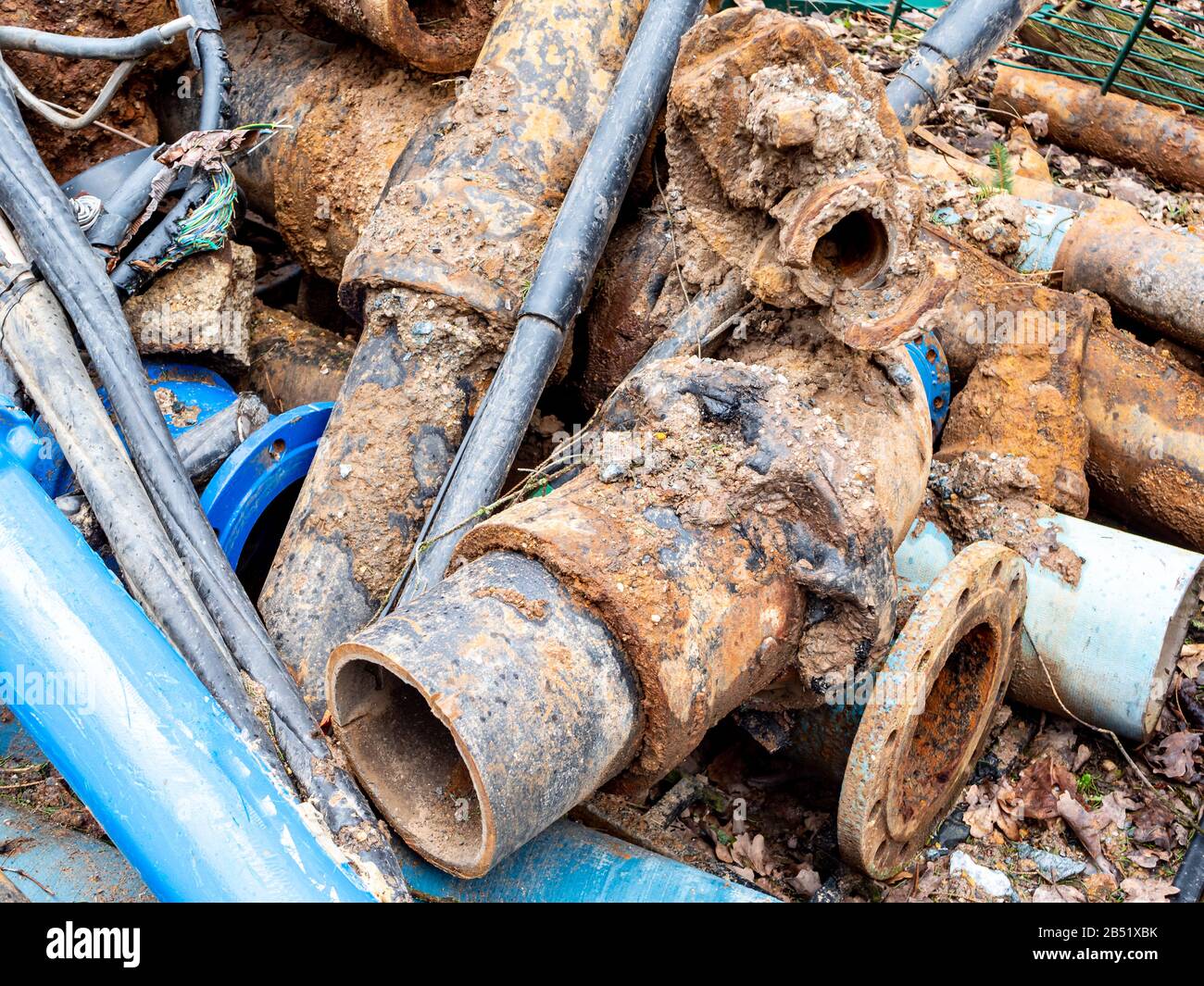 Old rusted water pipes on a construction site Stock Photo - Alamy