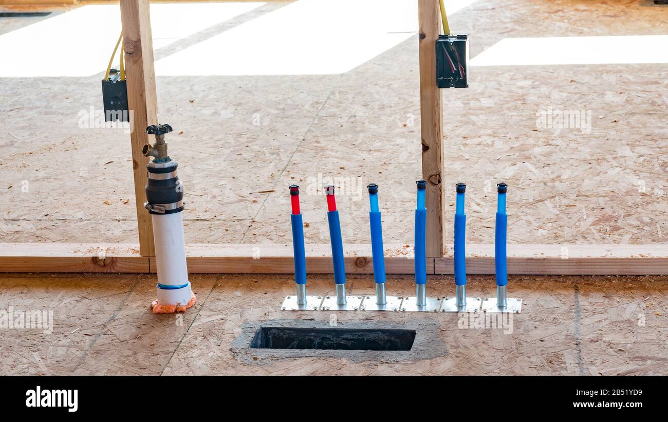 New home being built closeup of plumbing in floor Stock Photo - Alamy