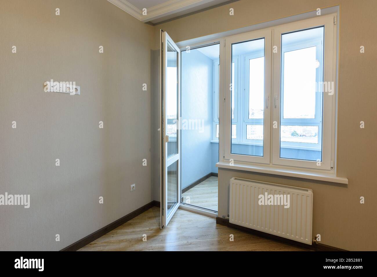Exit to the balcony in an empty apartment after repairs Stock Photo - Alamy