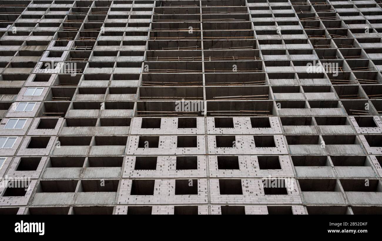 Windows, balcony and walls on construction multi storey building ...