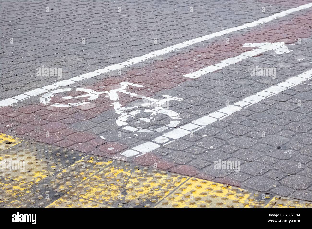 Old sign bike path on the sidewalk Stock Photo - Alamy