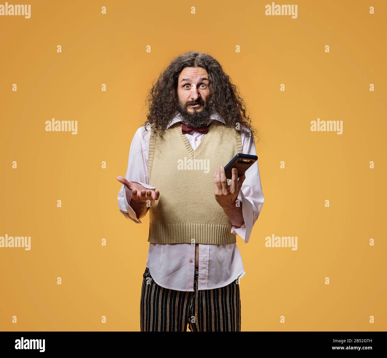 Funny nerd having an issue with the smartphone Stock Photo - Alamy
