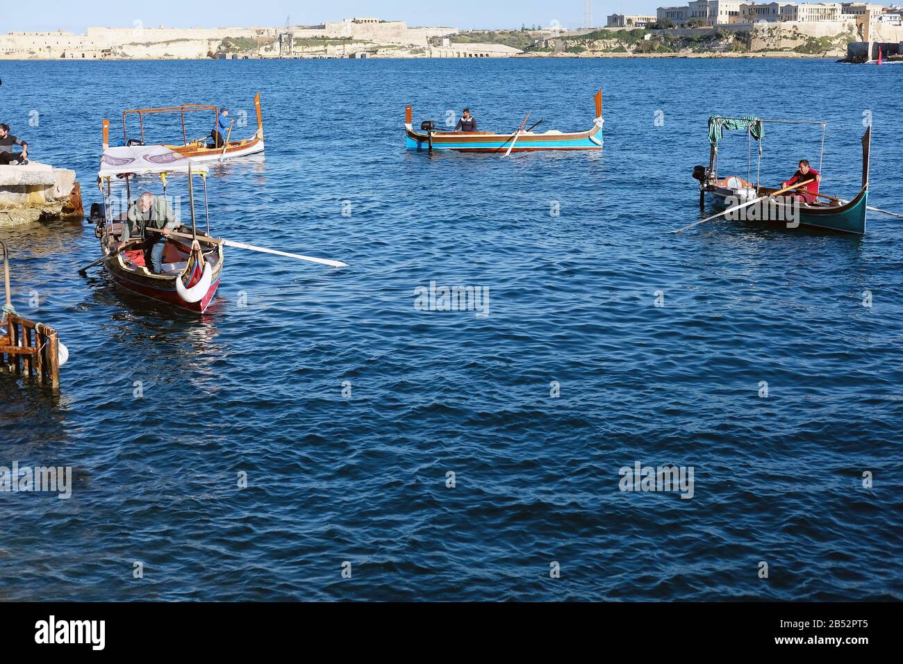 Valletta, Malta 03/06/2020 Water taxis (dgħajsa tal-pass) taking ...