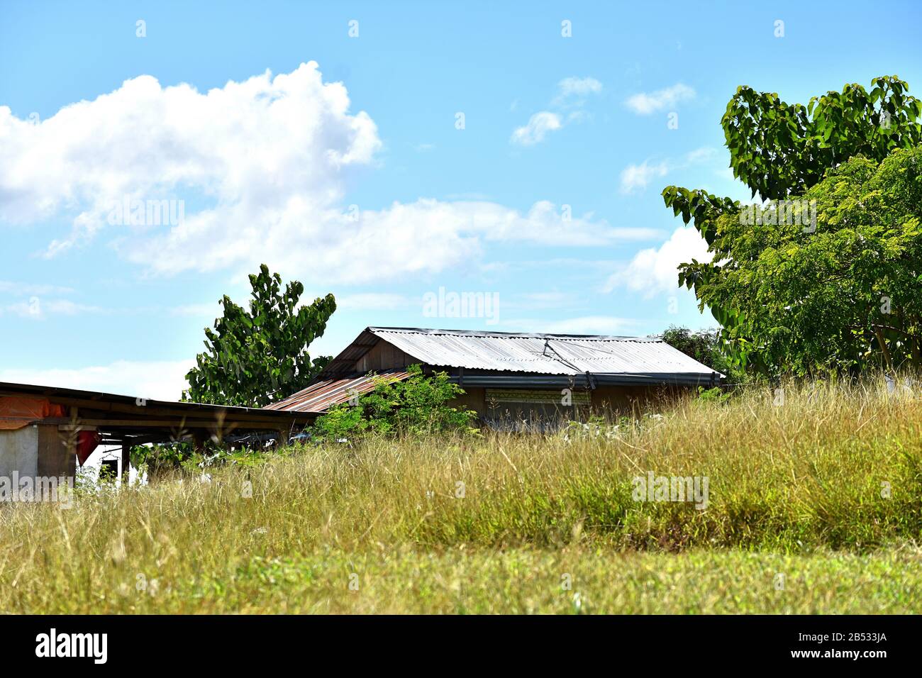 Old Dilapidated Building On Grassy Hillside Stock Photo - Alamy