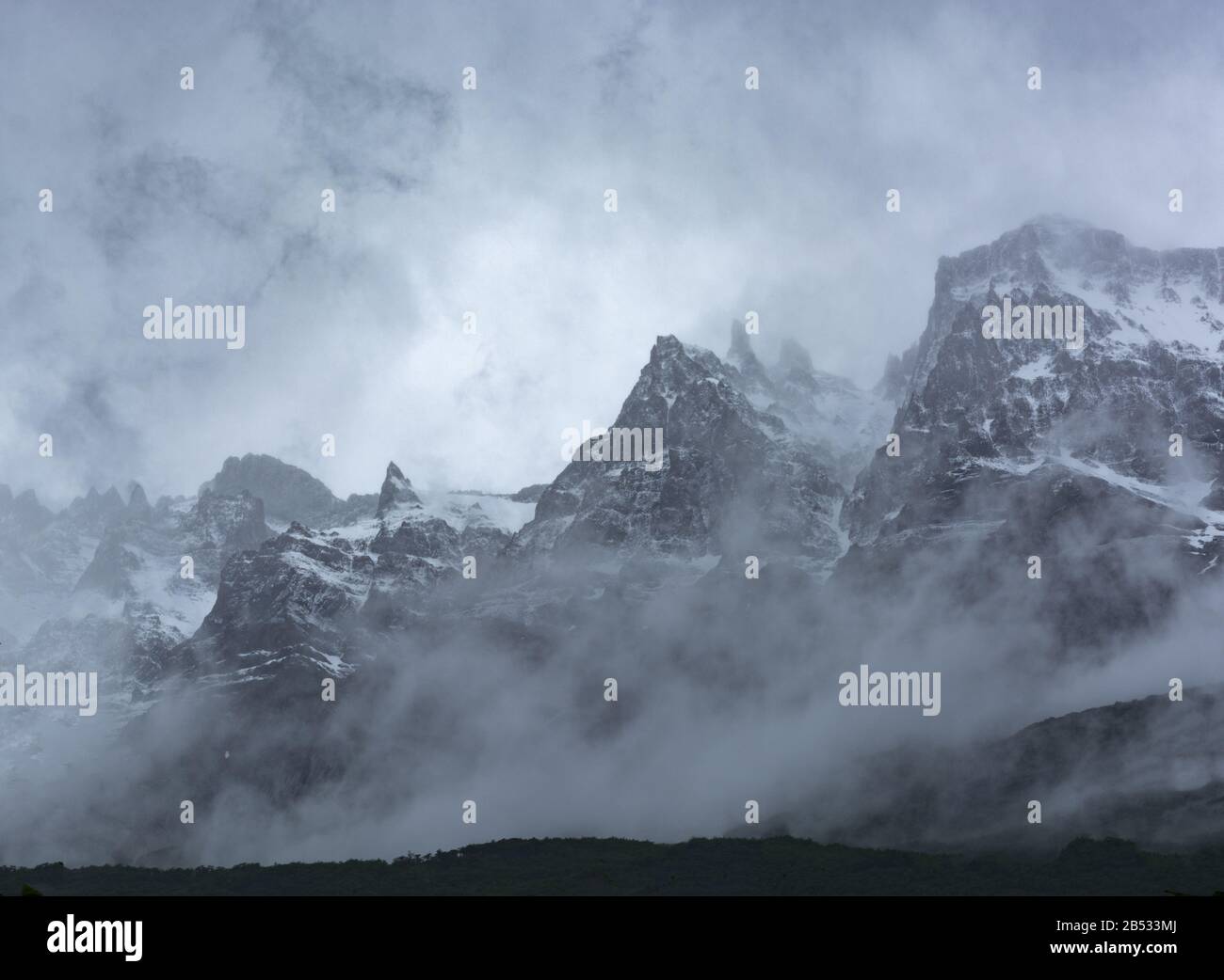 A short break in the storm reveals the imposing Andes range engulfed by ...