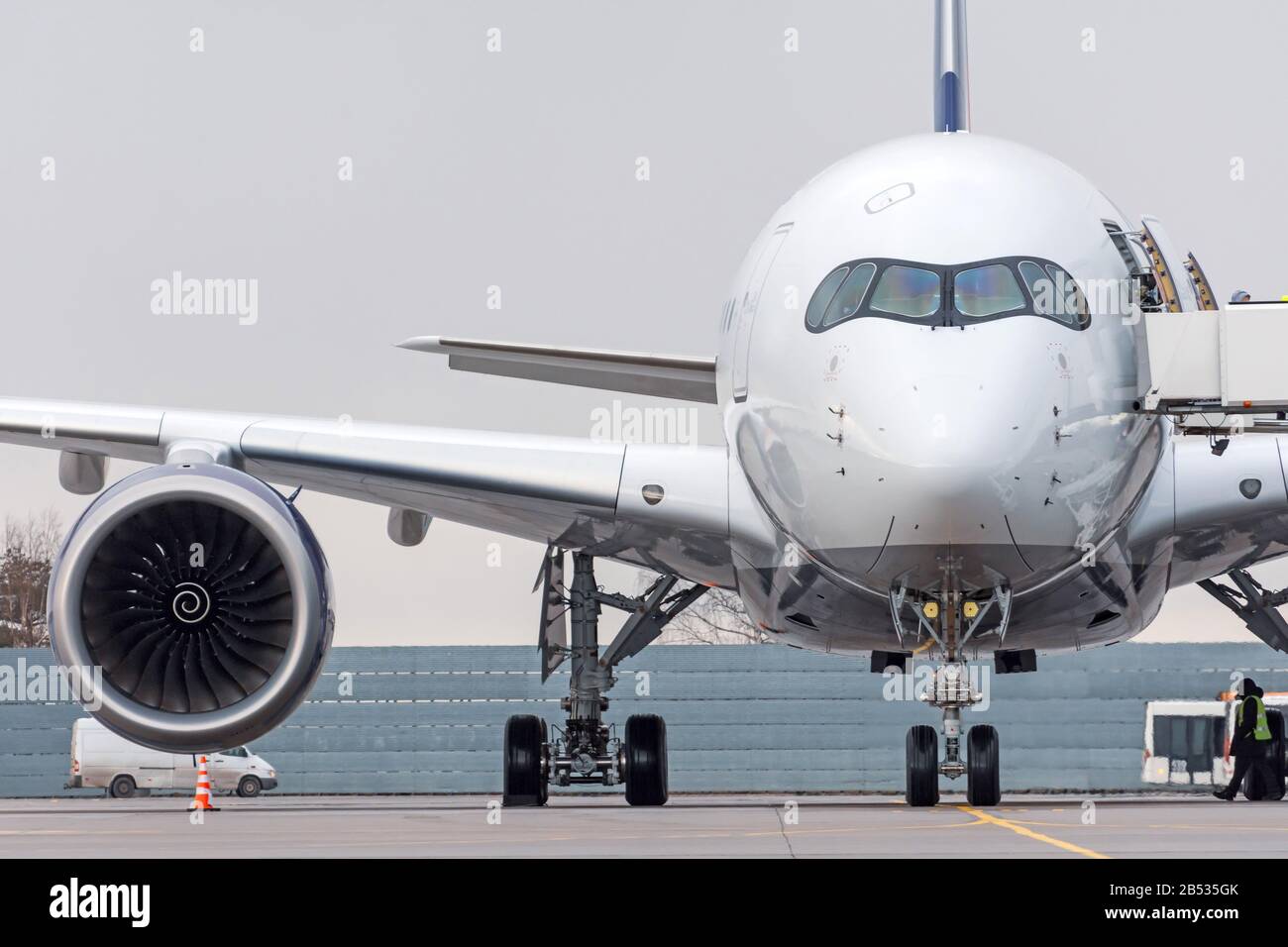 Exactly front view of the cockpit and nose, wing and engine of the ...